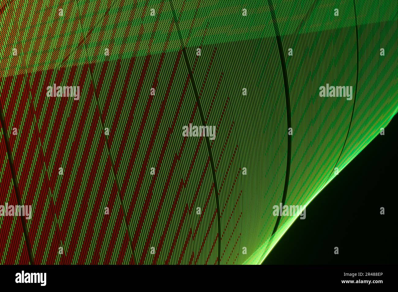 A large display featuring a pattern of green lights radiating outward ...