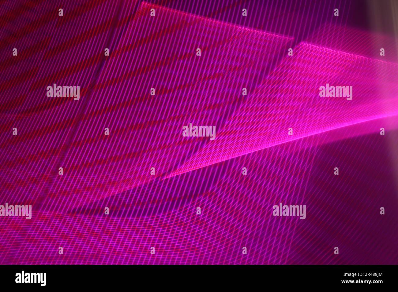 A large display featuring a pattern of pink lights radiating outward ...
