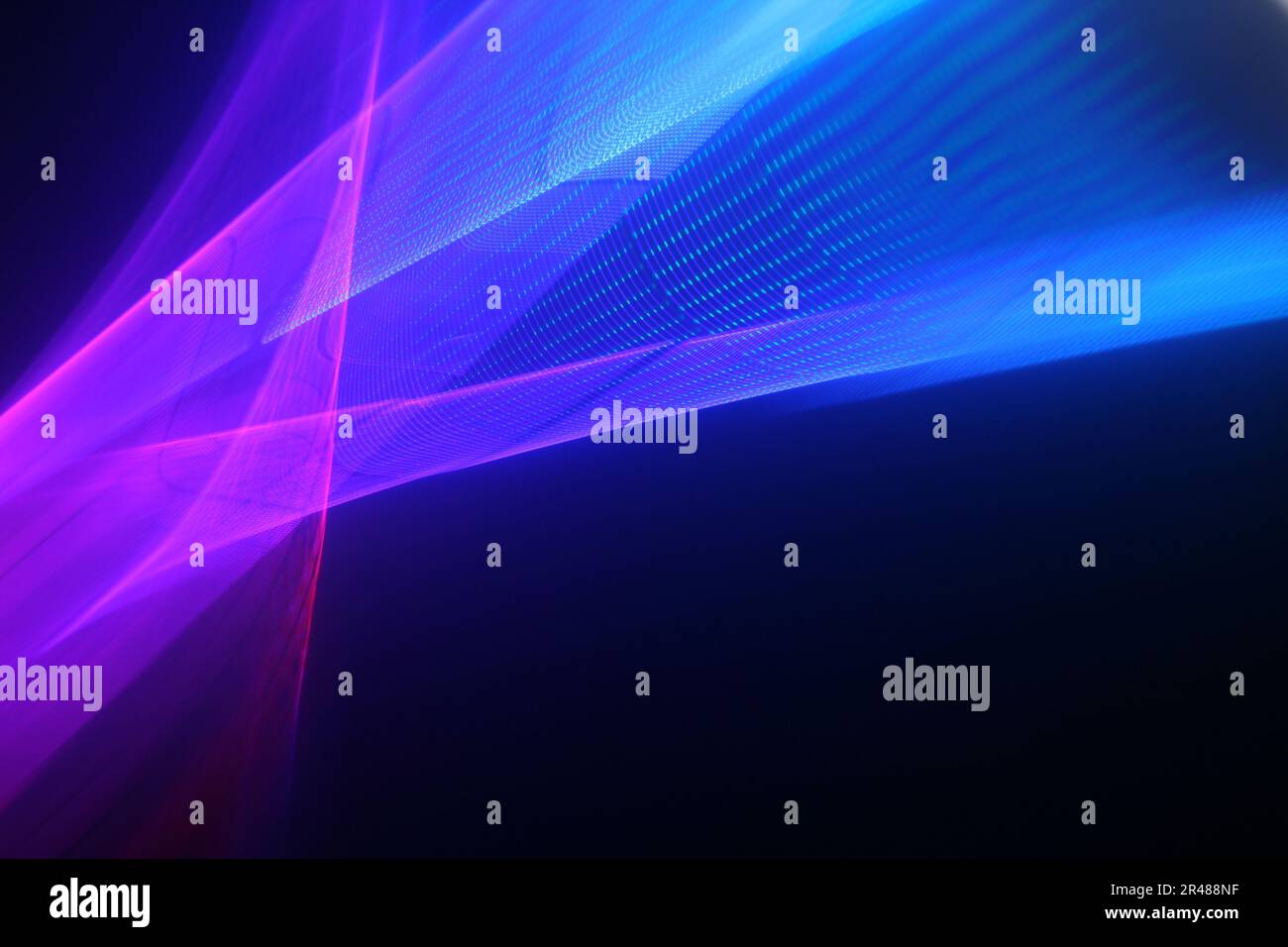 A large display featuring a pattern of purple and blue lights radiating ...