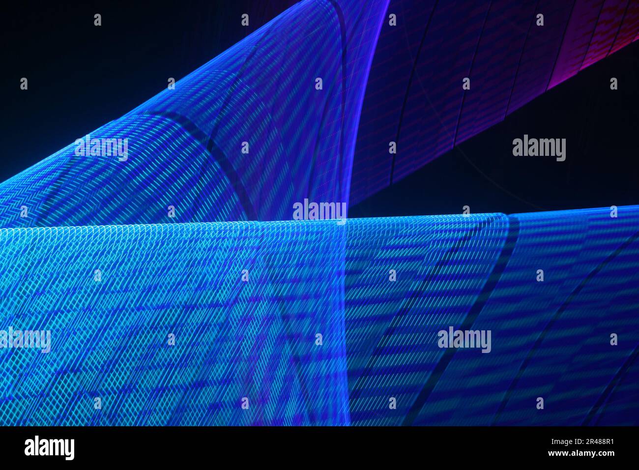 A large display featuring a pattern of blue lights radiating outward ...