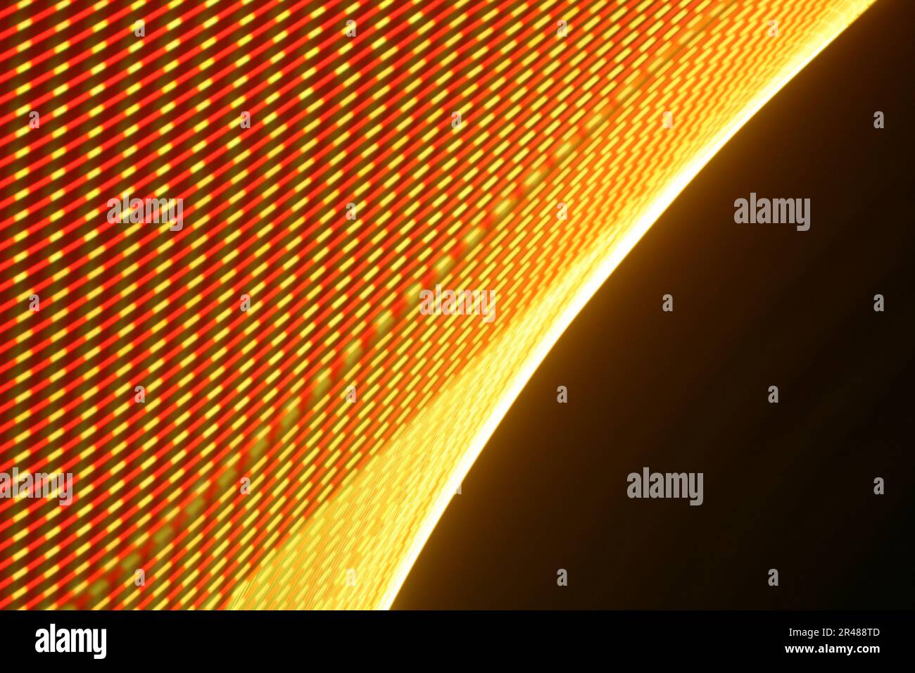 A large display featuring a pattern of red and yellow lights radiating ...