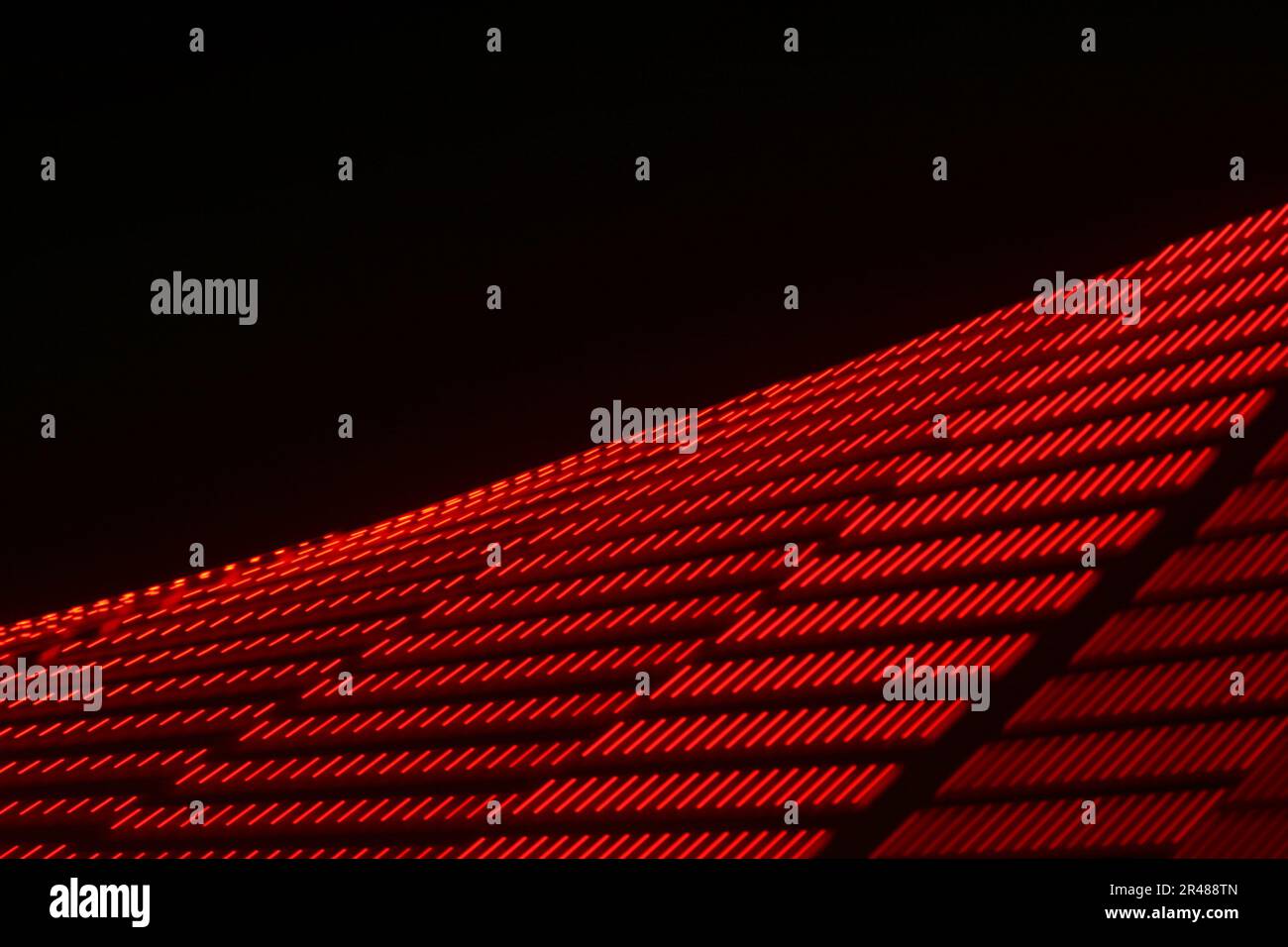 A large display featuring a pattern of red lights radiating outward ...