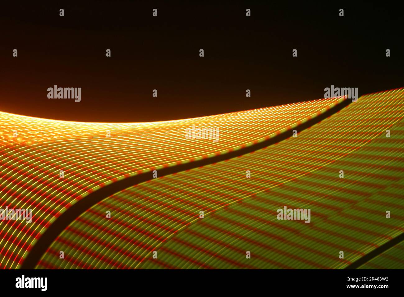 A large display featuring a pattern of red and yellow lights radiating ...