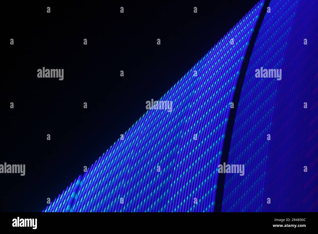 A large display featuring a pattern of blue lights radiating outward ...