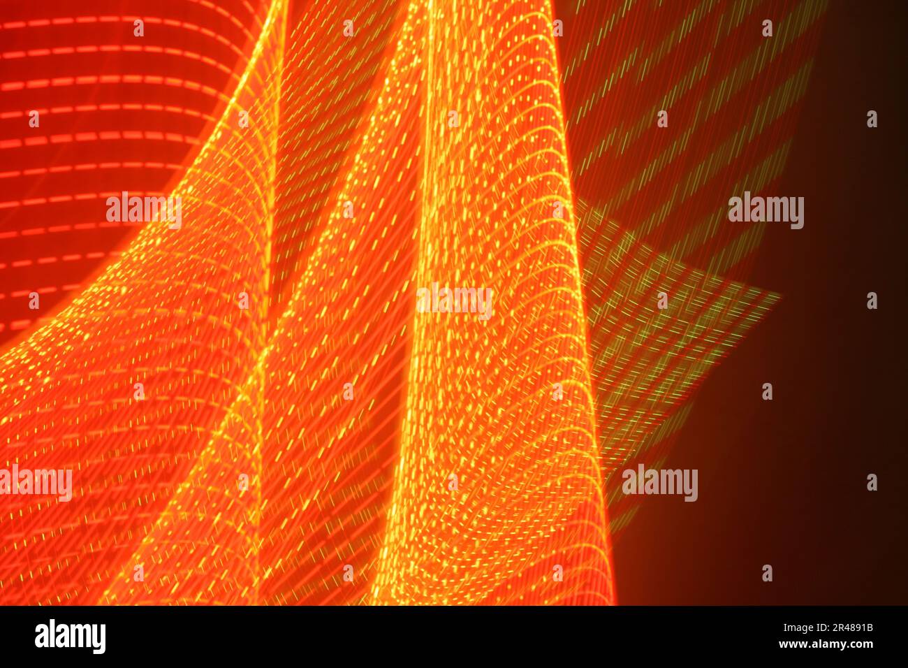 A large display featuring a pattern of red and yellow lights radiating ...