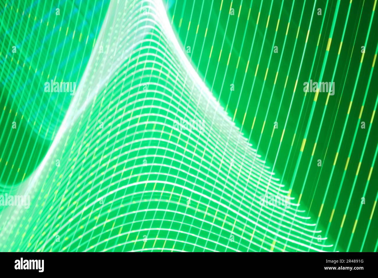 A large display featuring a pattern of green lights radiating outward ...