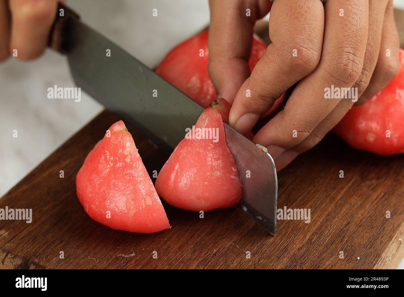 Asian female hand slicing hi-res stock photography and images - Alamy