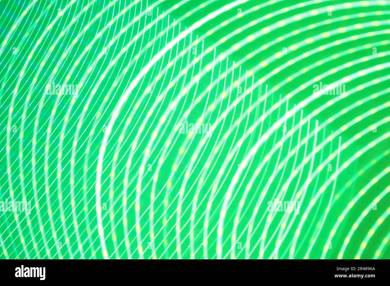 A large display featuring a pattern of green lights radiating outward ...