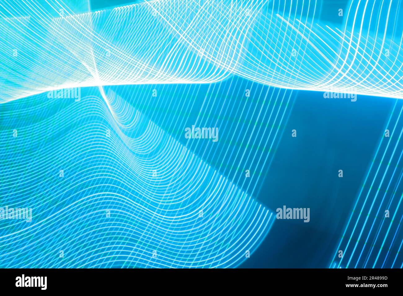 A large display featuring a pattern of blue lights radiating outward ...