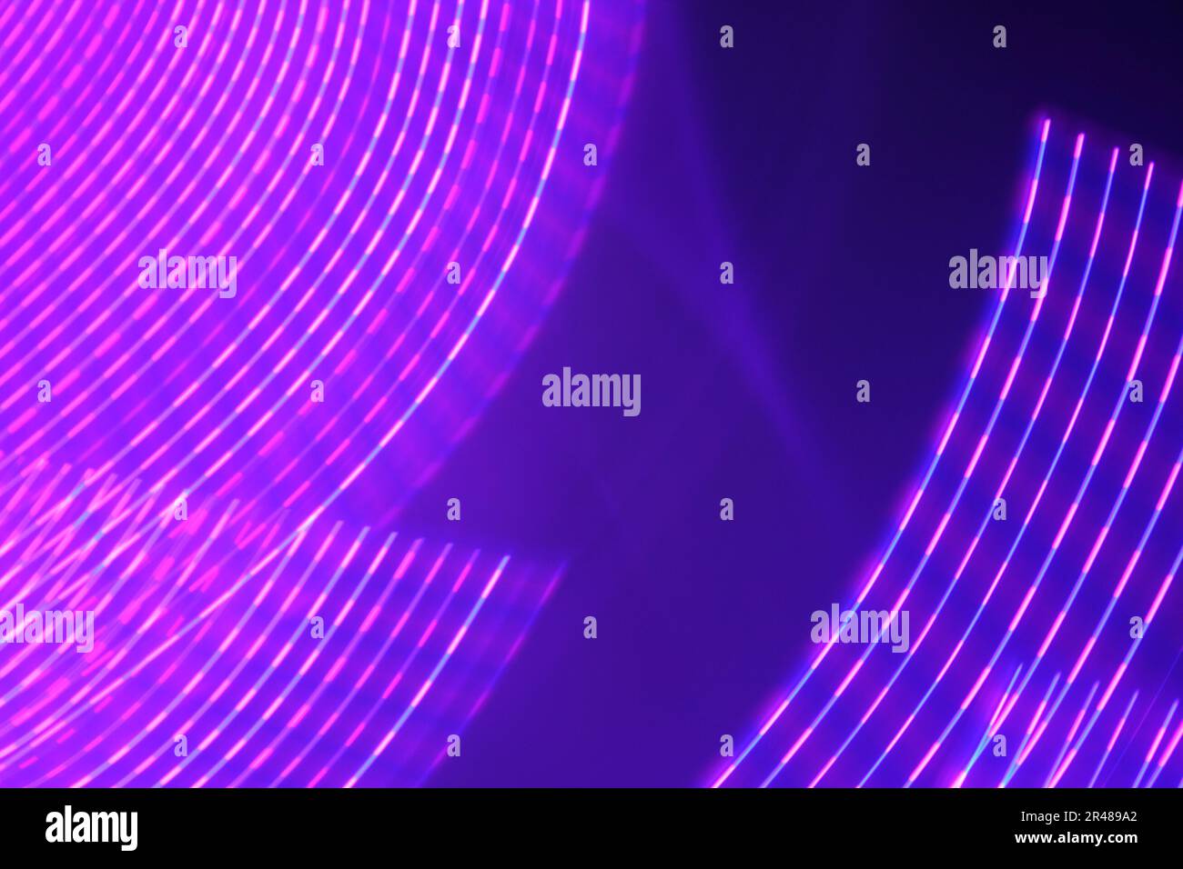 A large display featuring a pattern of pink lights radiating outward ...