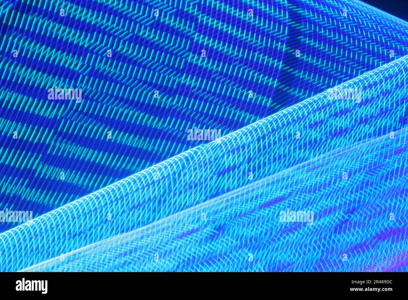 A large display featuring a pattern of blue lights radiating outward ...