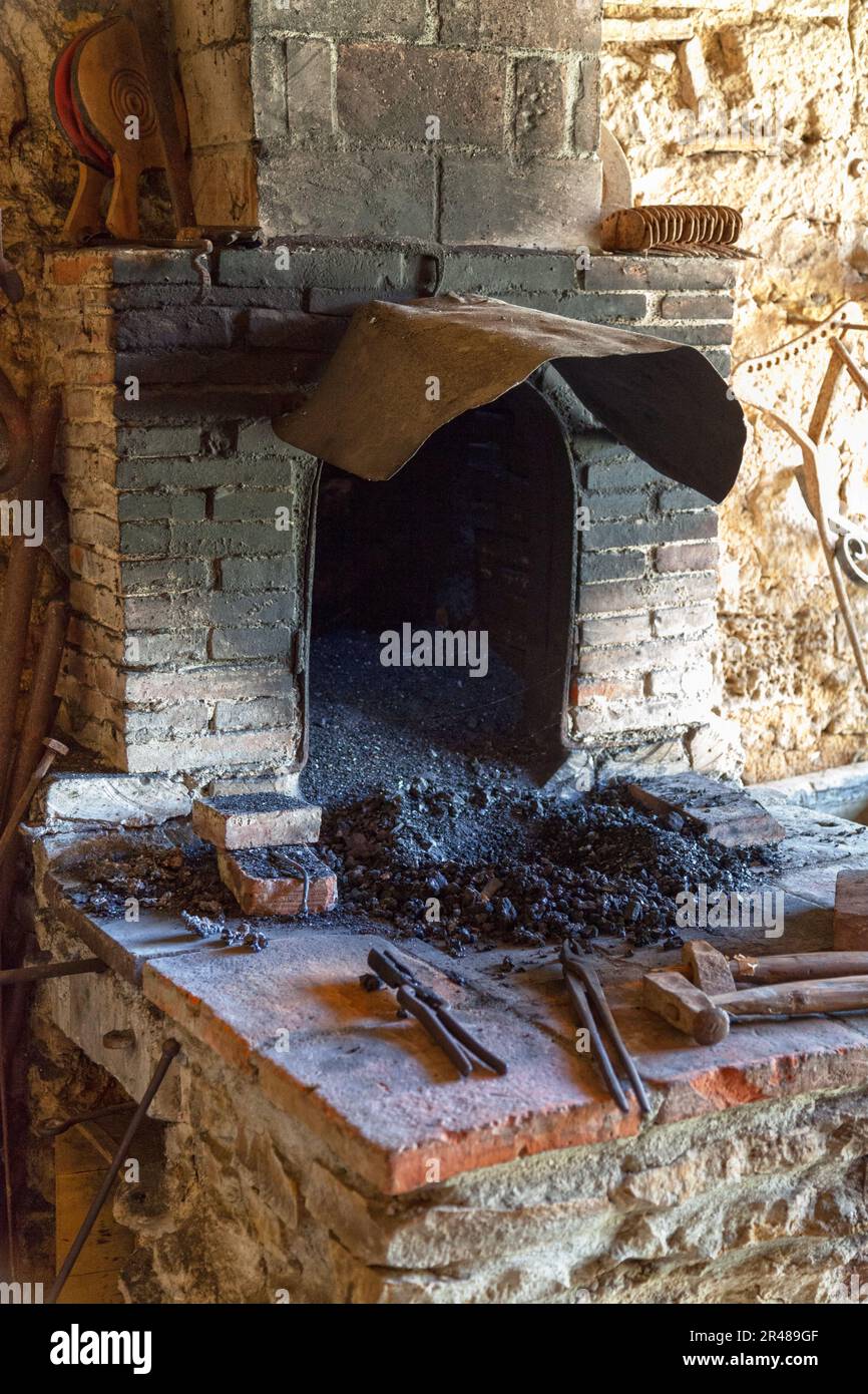 Old forge and a set of tools for a blacksmith Stock Photo - Alamy