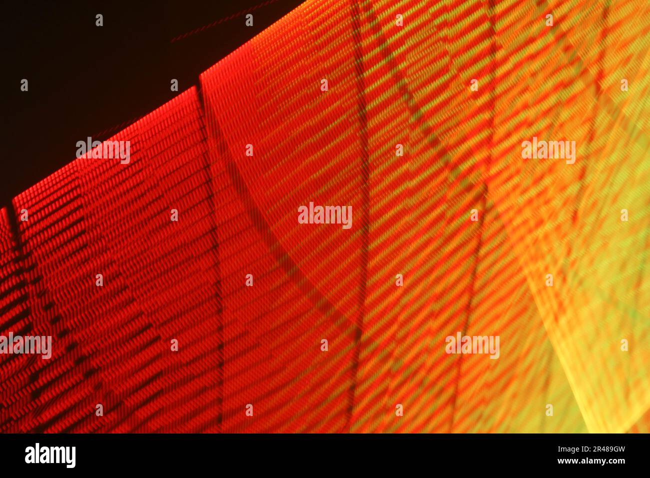 A large display featuring a pattern of red and yellow lights radiating ...