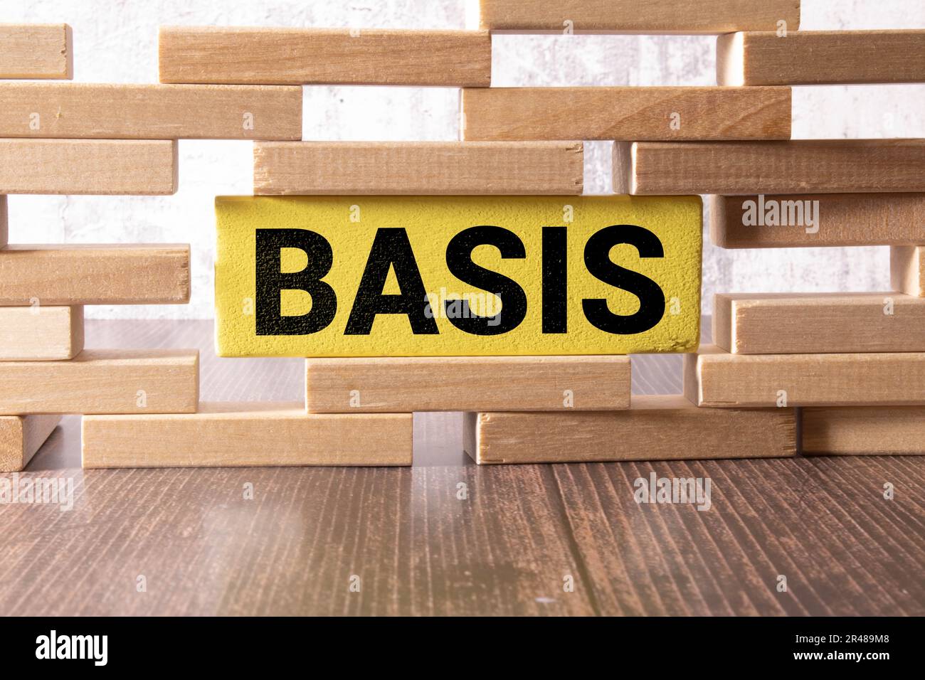 White tile alphabet letter with word basis on wood background Stock ...