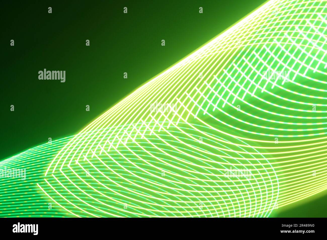 A large display featuring a pattern of green lights radiating outward ...