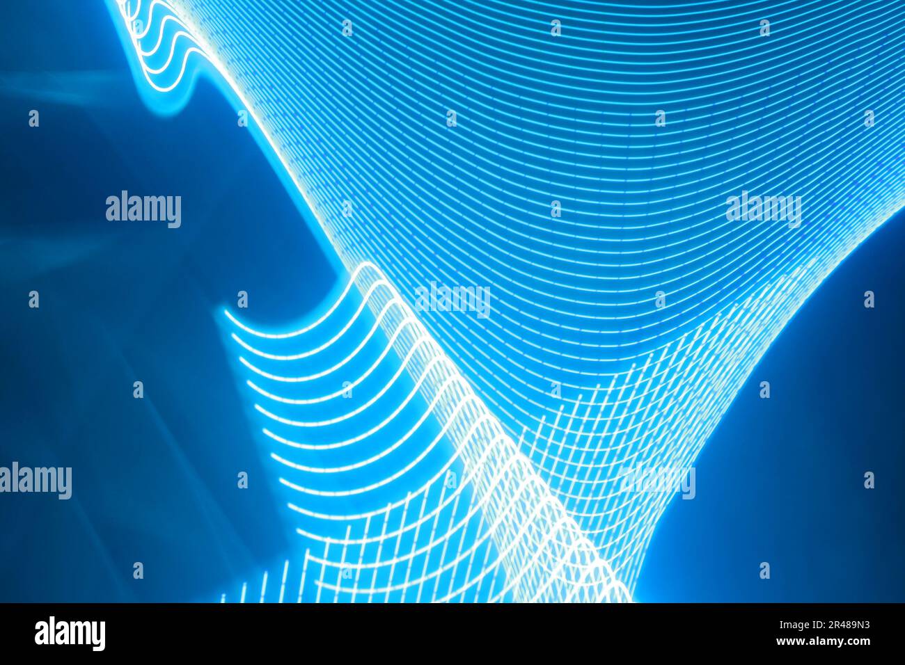 A large display featuring a pattern of blue lights radiating outward ...