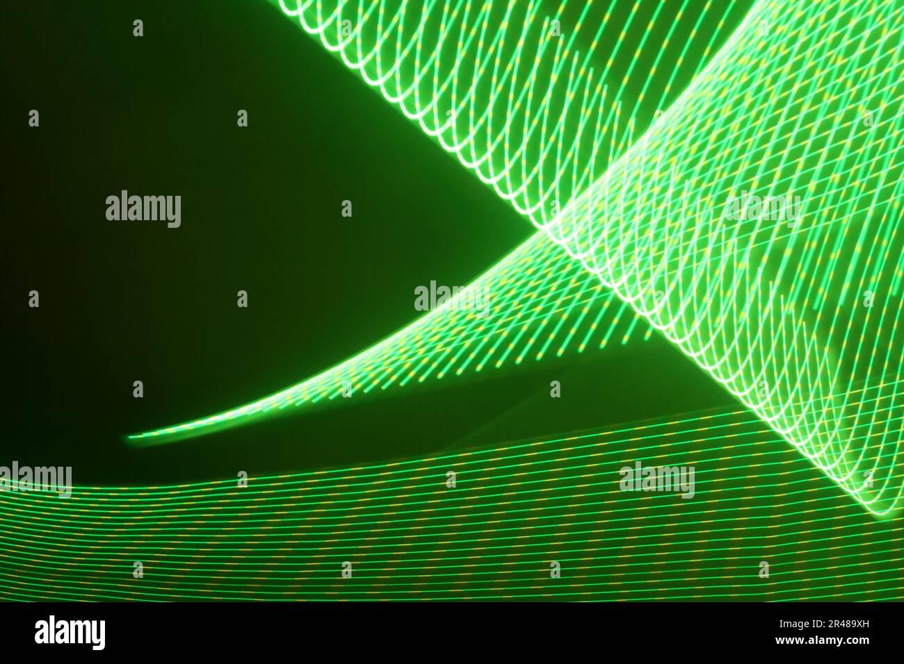 A large display featuring a pattern of green lights radiating outward ...