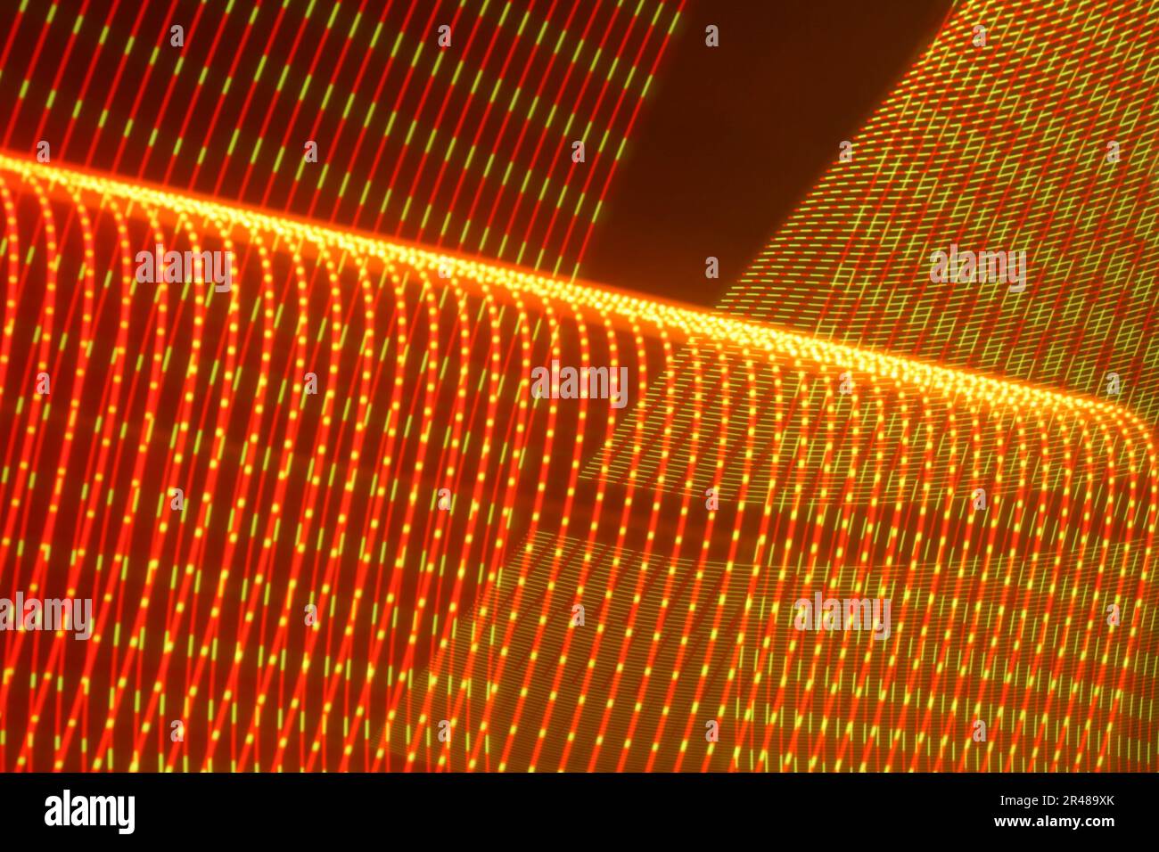 A large display featuring a pattern of red and yellow lights radiating ...
