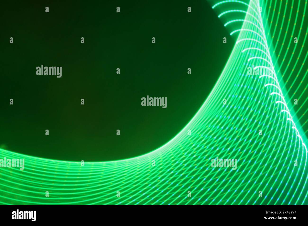 A large display featuring a pattern of green lights radiating outward ...