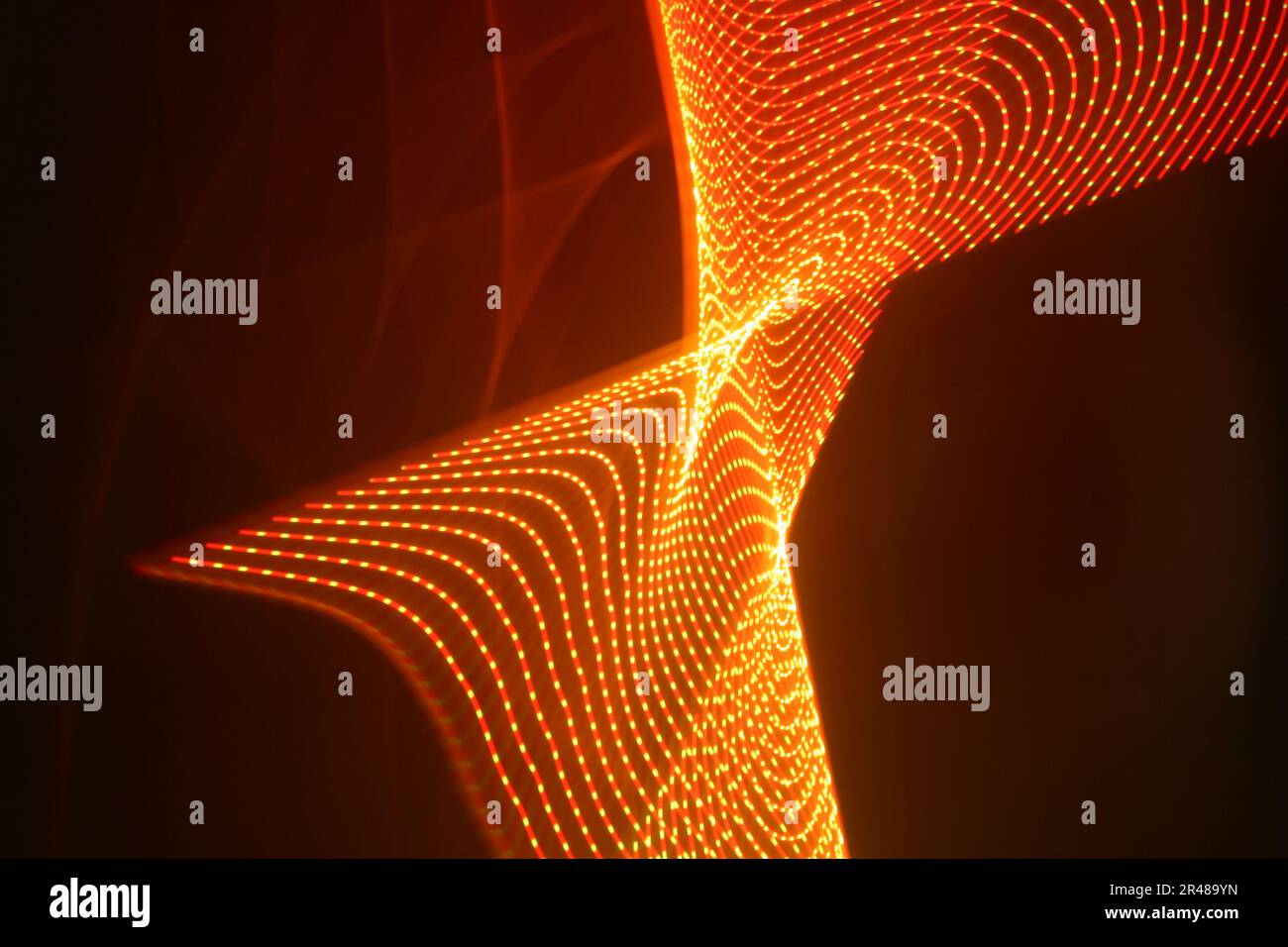 A large display featuring a pattern of red and yellow lights radiating ...