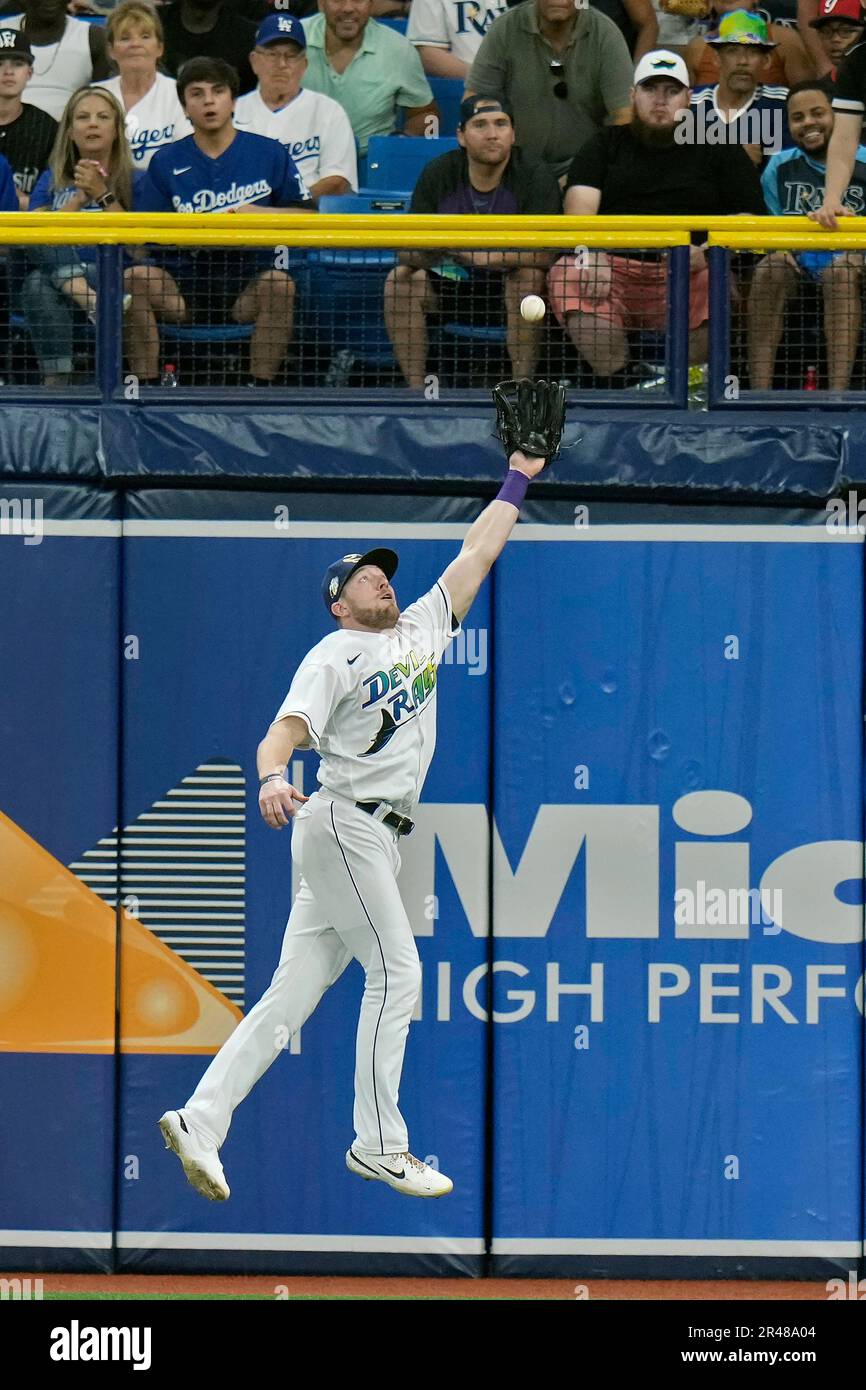 Tampa Bay Rays right fielder Luke Raley leaps but can't make the catch ...