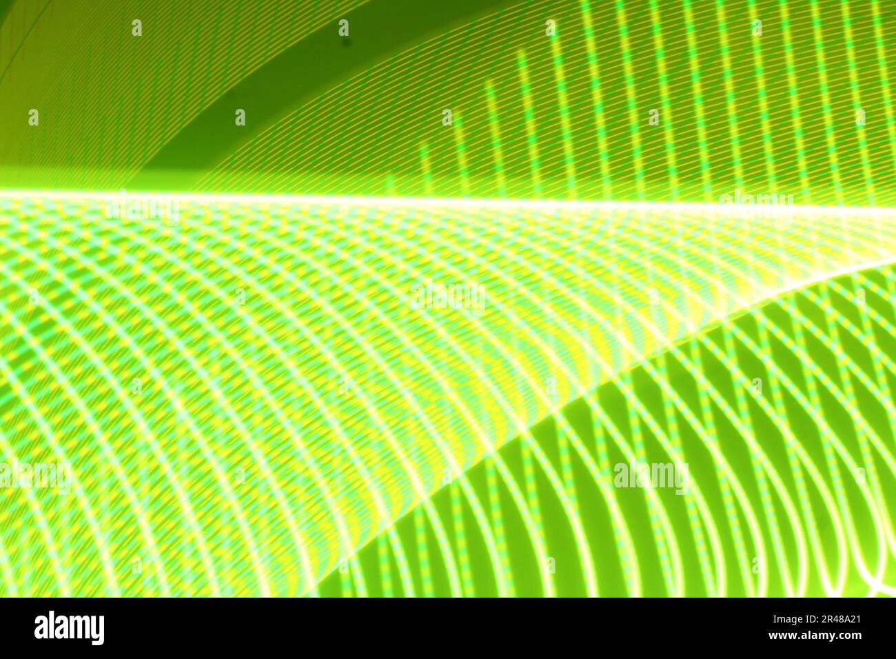 A large display featuring a pattern of green lights radiating outward ...