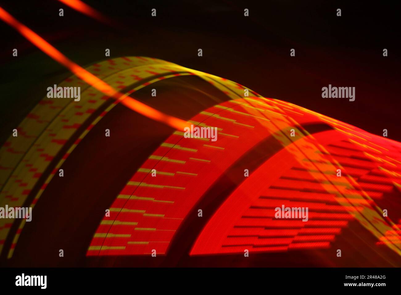 A large display featuring a pattern of red and yellow lights radiating ...