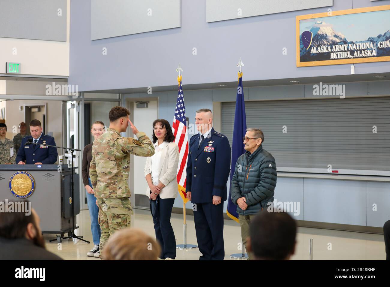 Alaska Air National Guardsman Airman 1st Class George Saxe, renders the ...