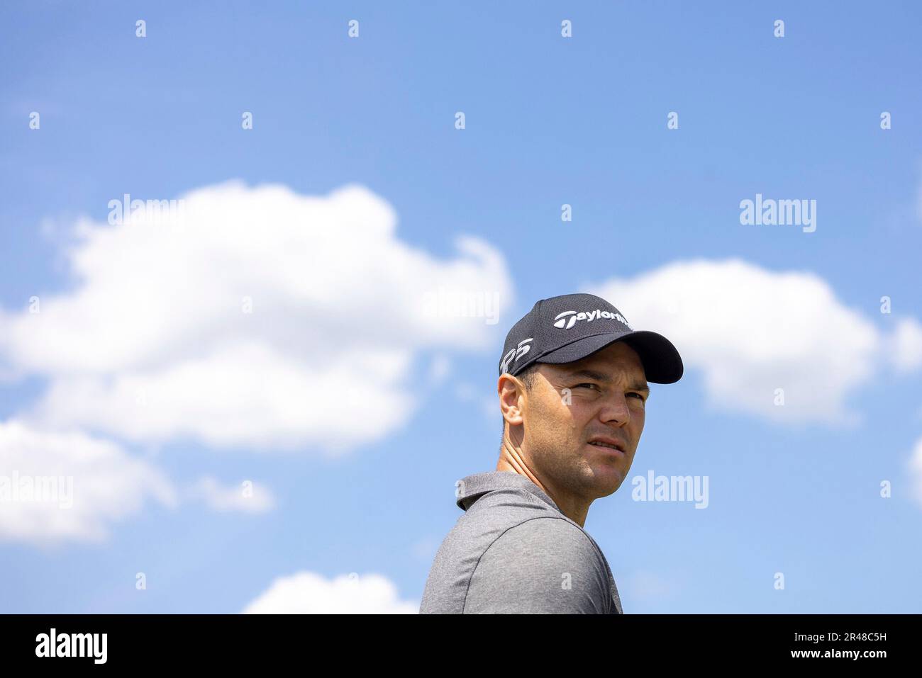 Captain Martin Kaymer of Cleeks GC looks on from the driving range ...