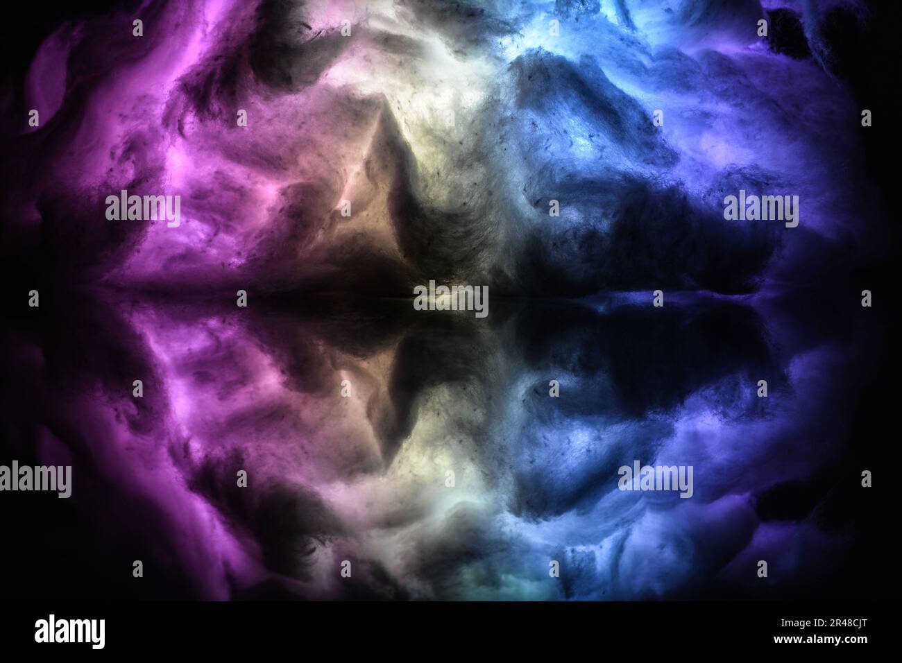 A vibrant array of powder being thrown against a dark background ...