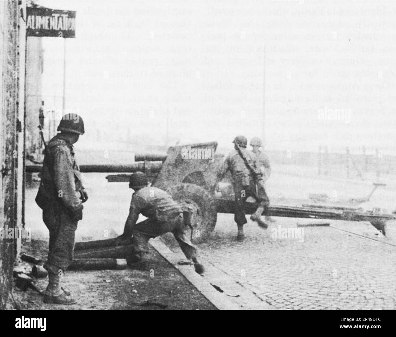 US Army artillerymen firing a 3-inch Gun at German Defenses in Saint ...