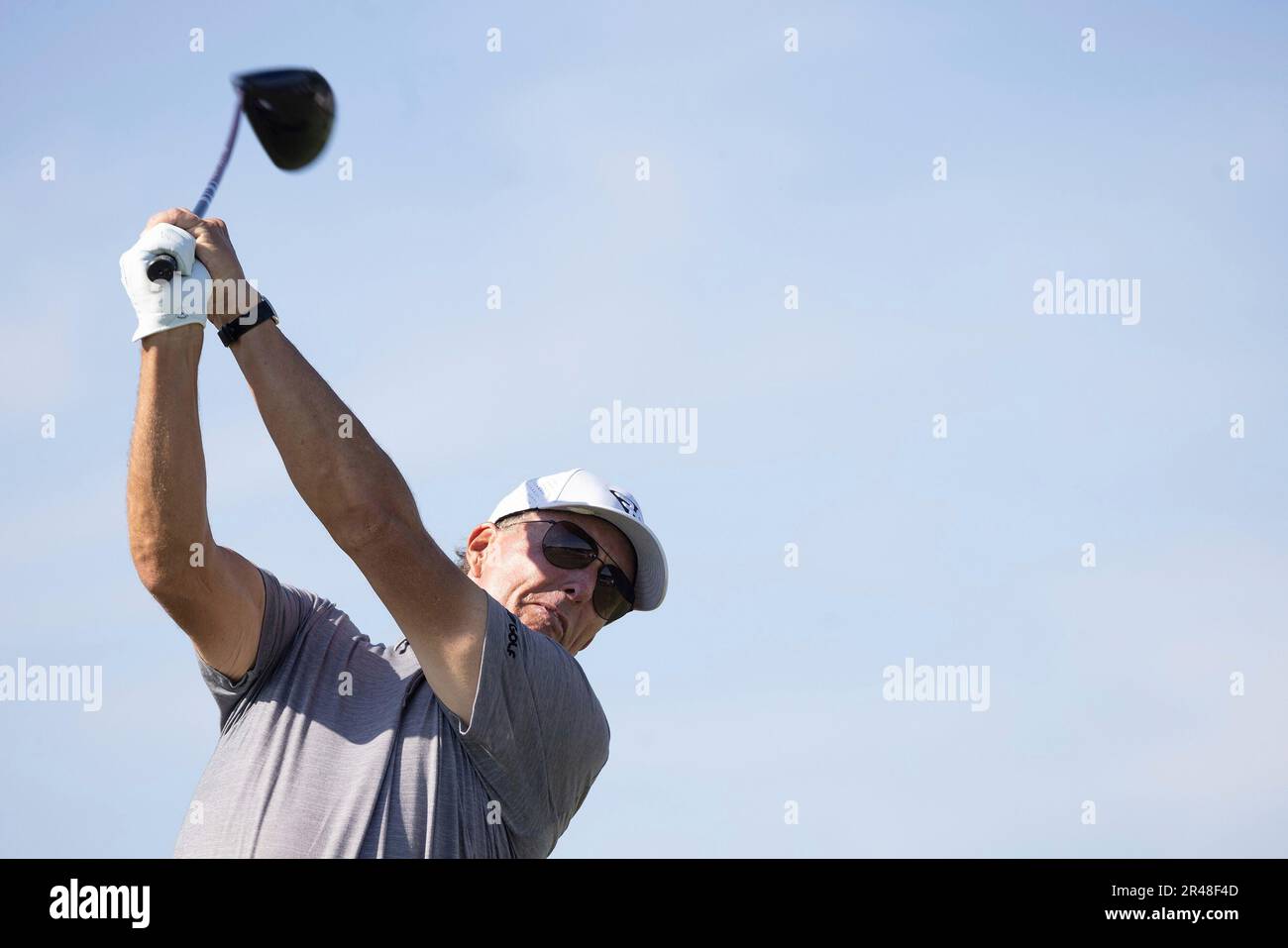 Captain Phil Mickelson of HyFlyers GC hits his shot from the 18th tee ...