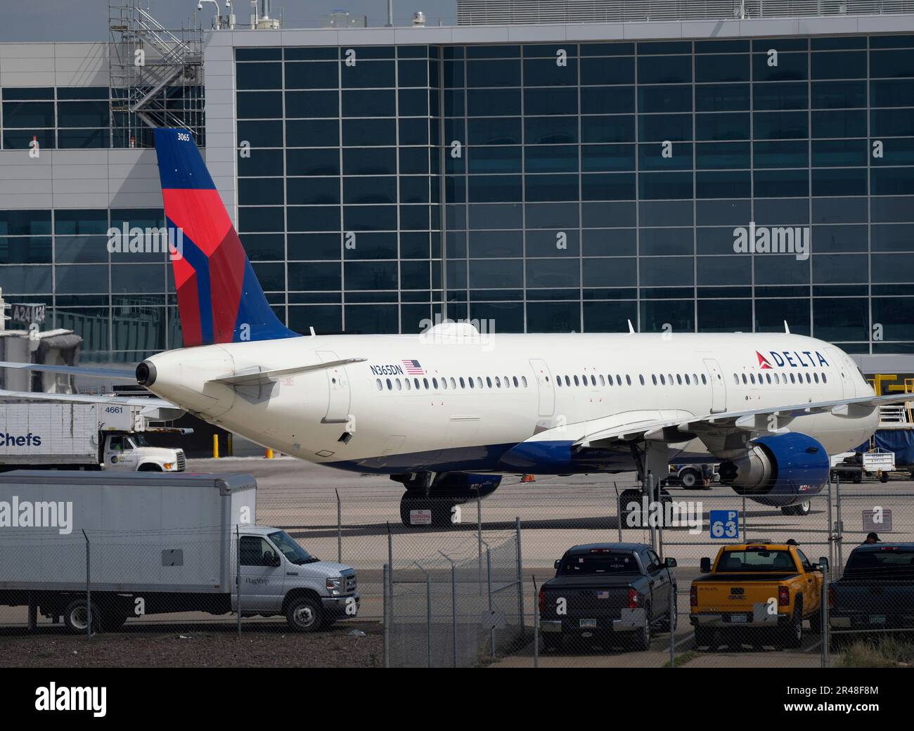 A Delta Airlines jetliner is pulled out of a gate at Denver ...