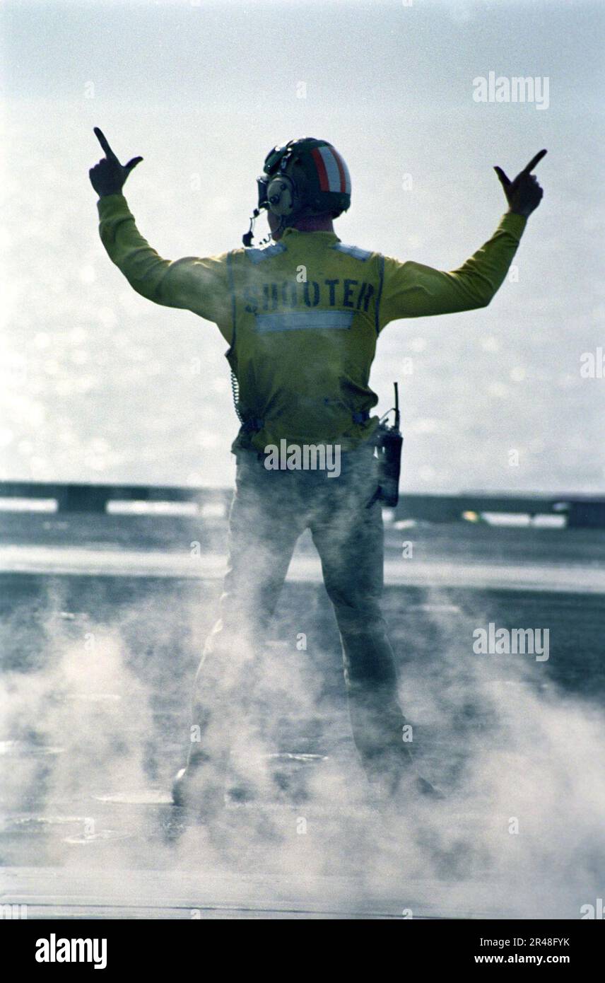US Navy A catapult ''shooter'' aboard the aircraft carrier USS ...