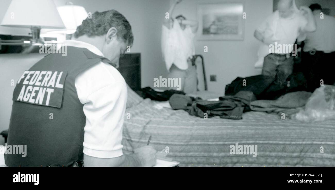 US Navy NCIS agent prepares sting operation Stock Photo - Alamy