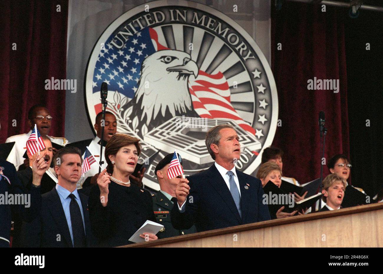 US Navy President George W. Bush and first lady Laura Bush wave the ...