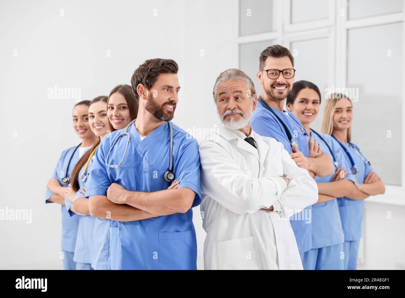 Doctor and his colleagues in hospital. Medical service Stock Photo - Alamy