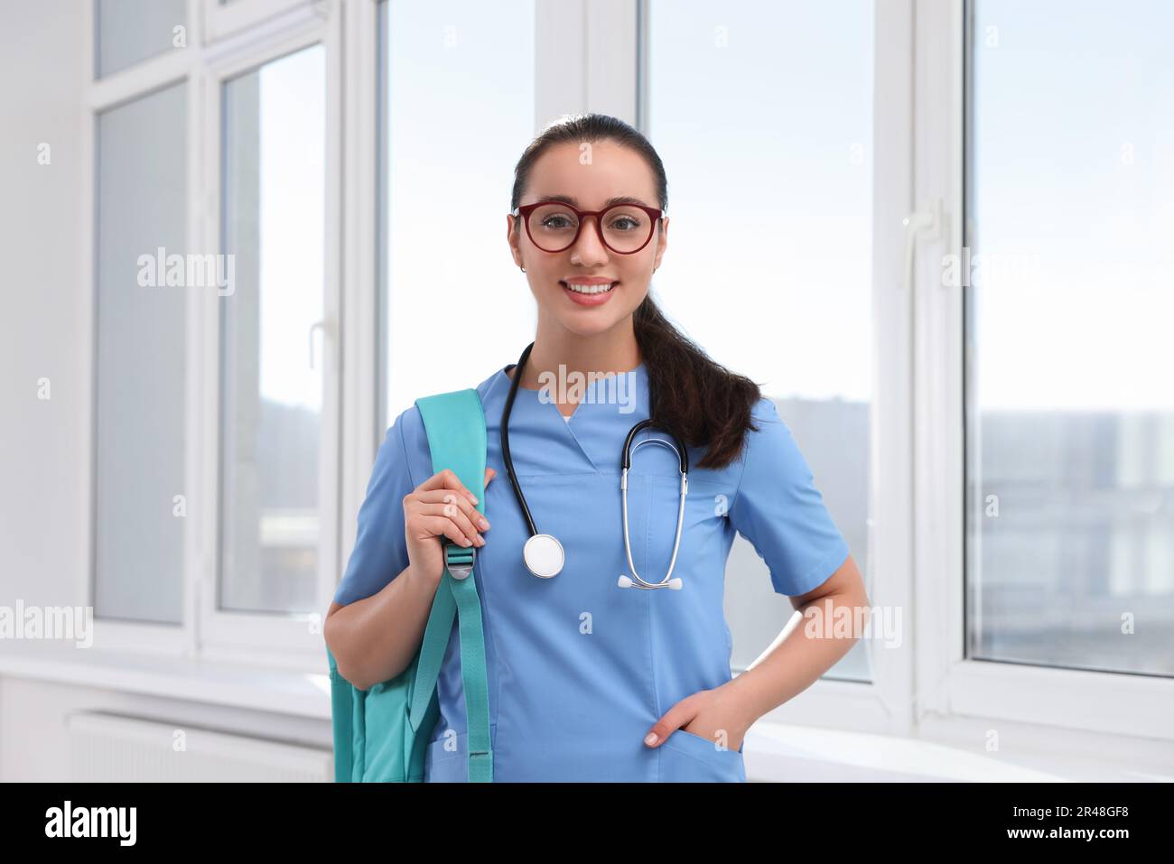 Smart medical student with stethoscope in college hallway Stock Photo ...