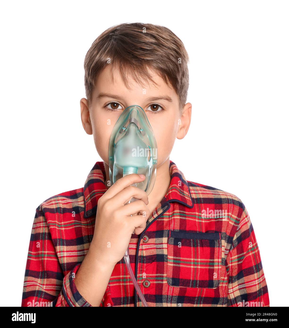 Boy using nebulizer for inhalation on white background Stock Photo - Alamy