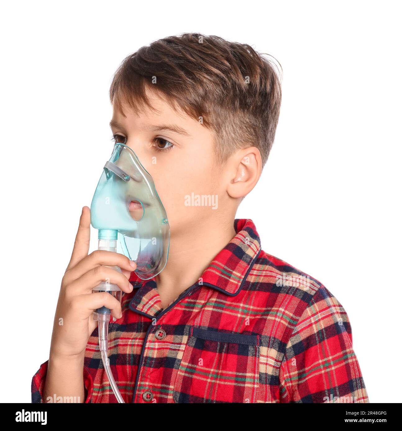 Boy using nebulizer for inhalation on white background Stock Photo - Alamy