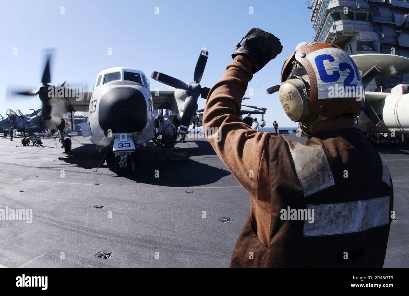 US Navy C-2 signaled to start portside engine Stock Photo - Alamy