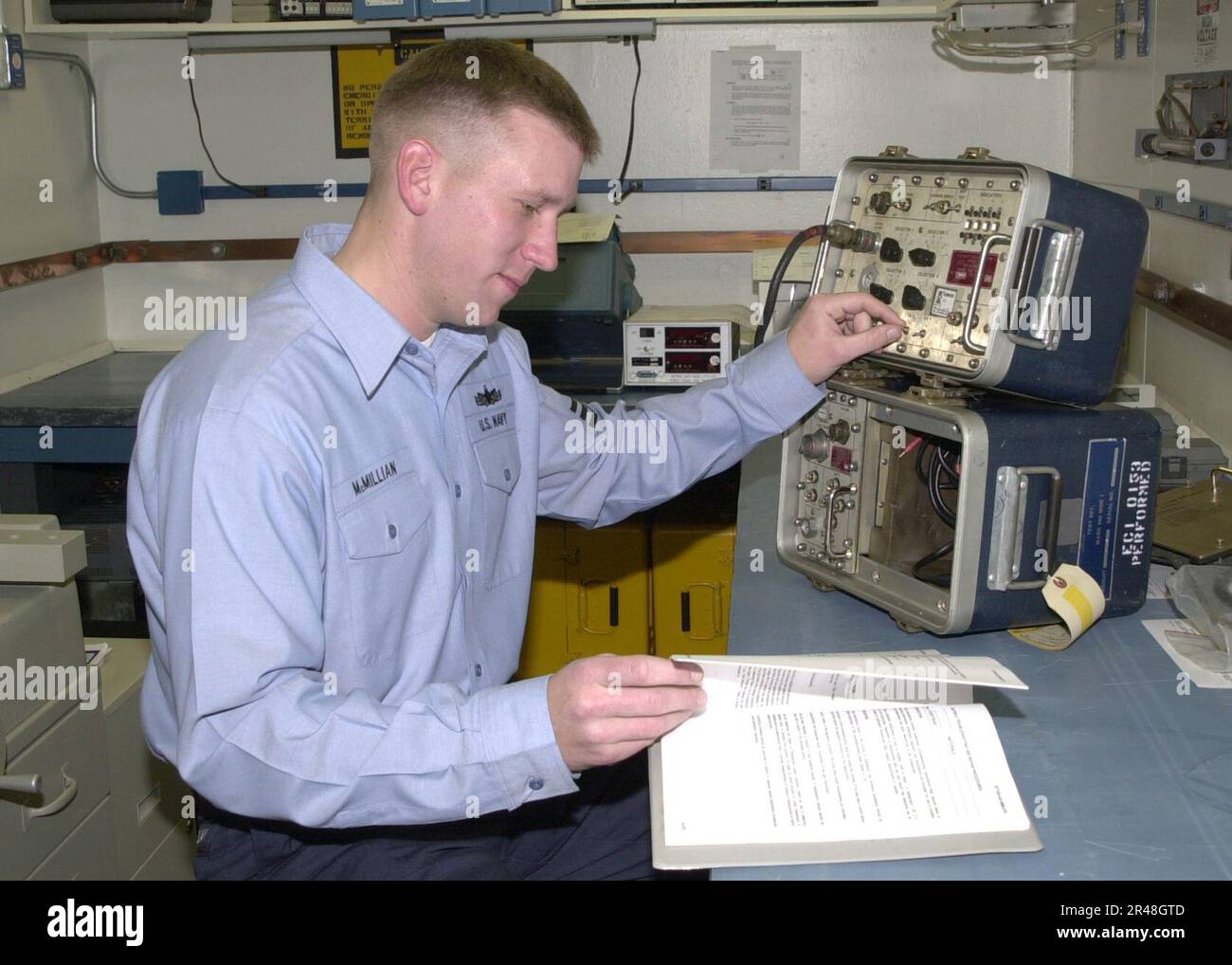 US Navy Sailor completes electronic bench test Stock Photo - Alamy