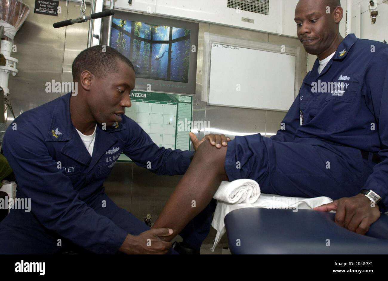 US Navy CVN 74 crew member receives medical treatment aboard ship Stock ...