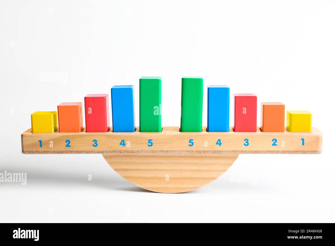 Wooden scale with colorful blocks isolated on white. Montessori toy ...