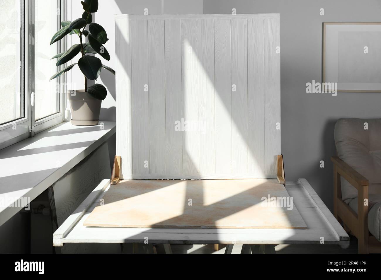 Double-sided backdrop on table in photo studio Stock Photo - Alamy