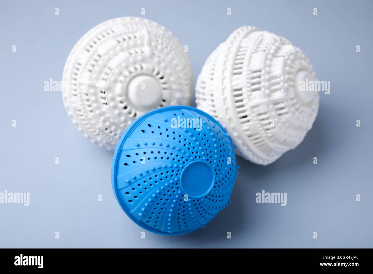 Dryer balls for washing machine on light grey background, closeup Stock ...