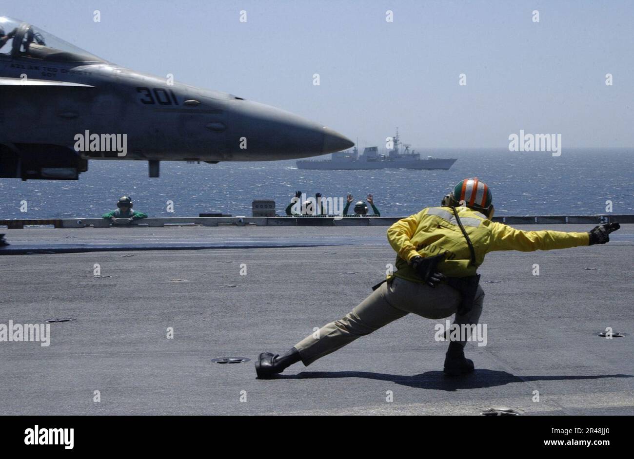 US Navy F-A-18 is given the signal to launch Stock Photo - Alamy