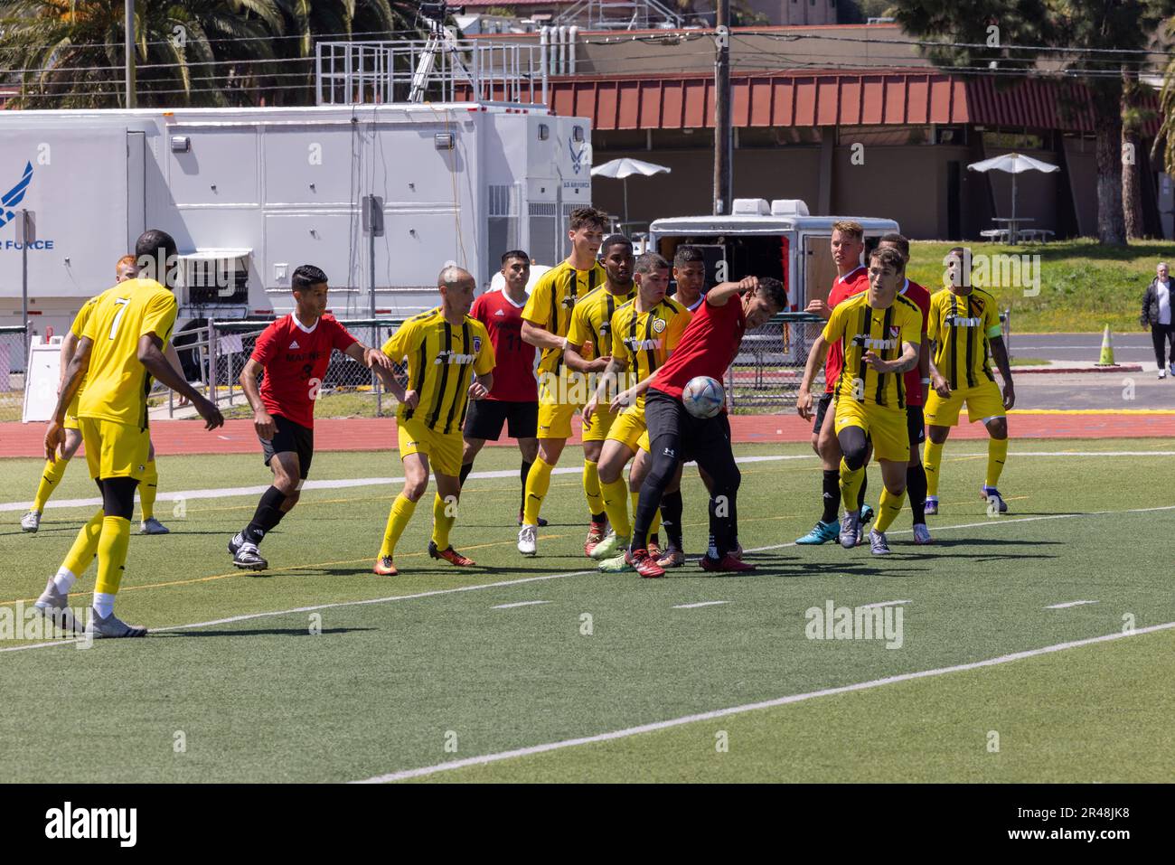 A U.S. Marine with the Marine Corps soccer team defends the ball during ...
