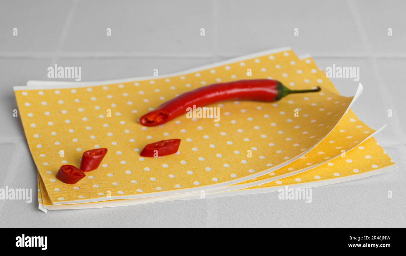 Pepper plaster and chili on white tiled table, closeup Stock Photo - Alamy