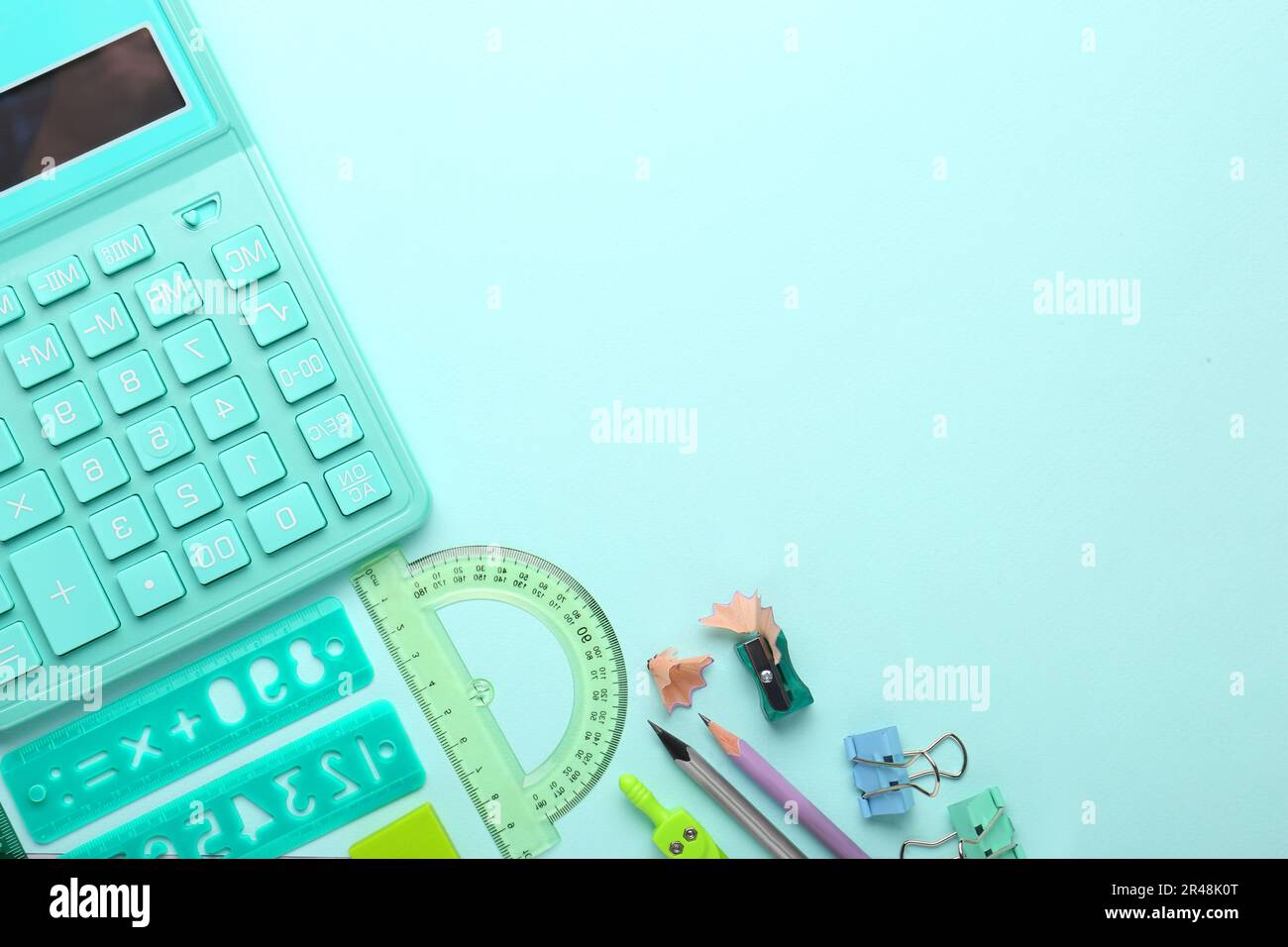 Calculator and stationery on light background, flat lay. Space for text ...